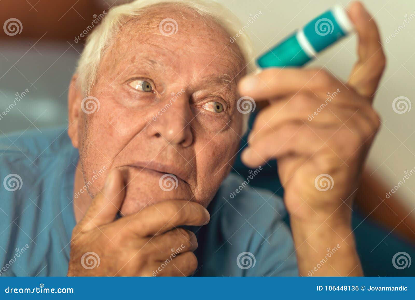Senior man using eye drops stock photo. Image of cataract - 106448136