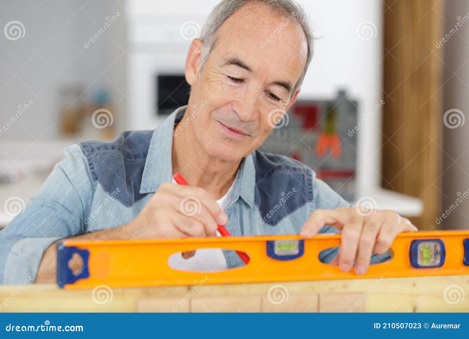Senior Man Using Handheld Tool Stock Image - Image of manual, plank ...