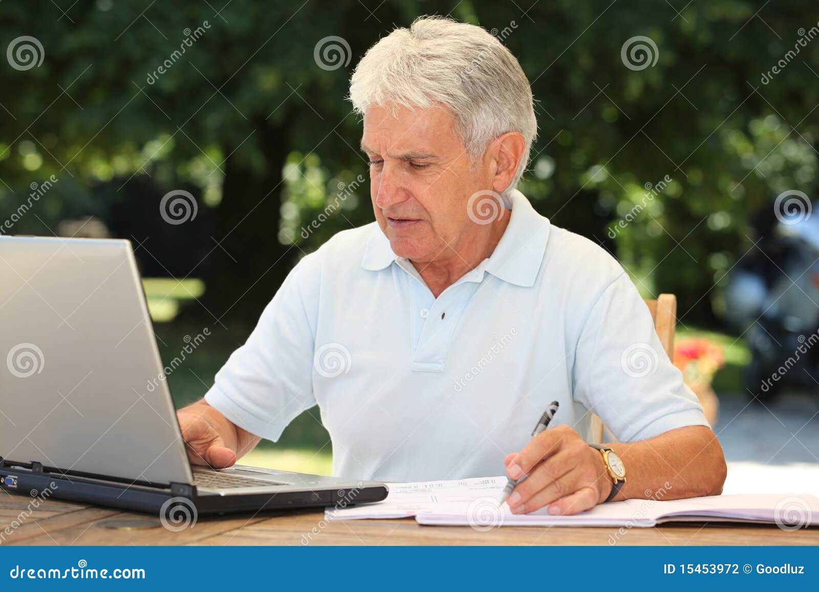 Senior Man Using Laptop in Garden Stock Photo - Image of technology ...