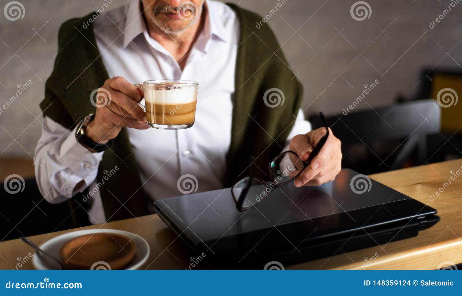 Senior Man Using Laptop and Having Coffee in the Bar Stock Photo ...
