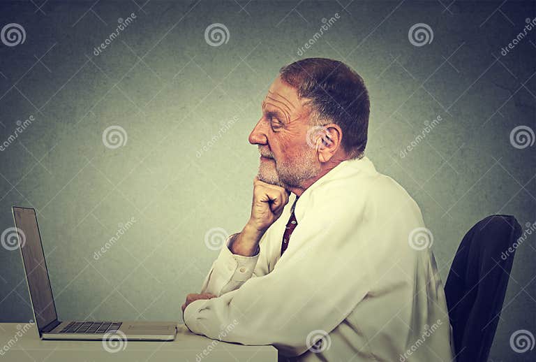 Senior Man Using Laptop Reading Email News. E-learning Concept Stock ...