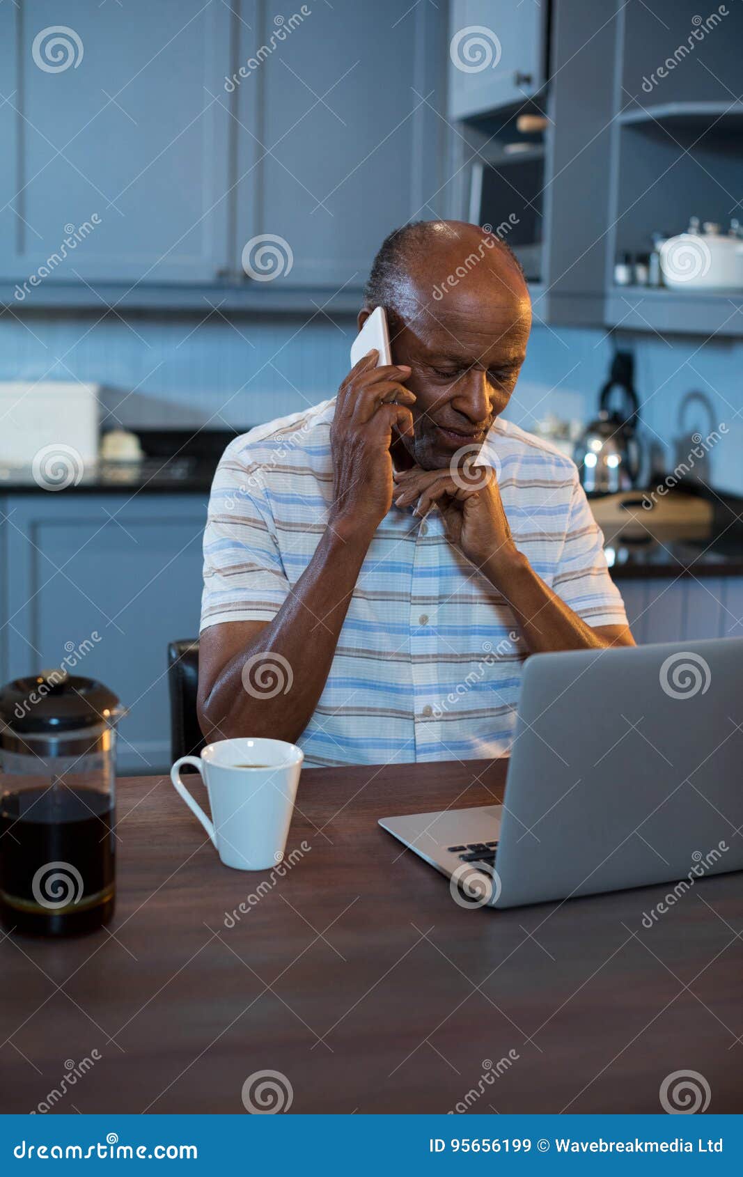 Senior Man Using Laptop at Table Stock Image - Image of domestic ...