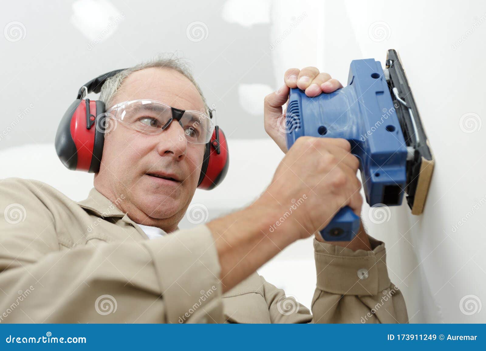 Senior Man Using Sander on Plasterboard Wall Stock Image - Image of ...