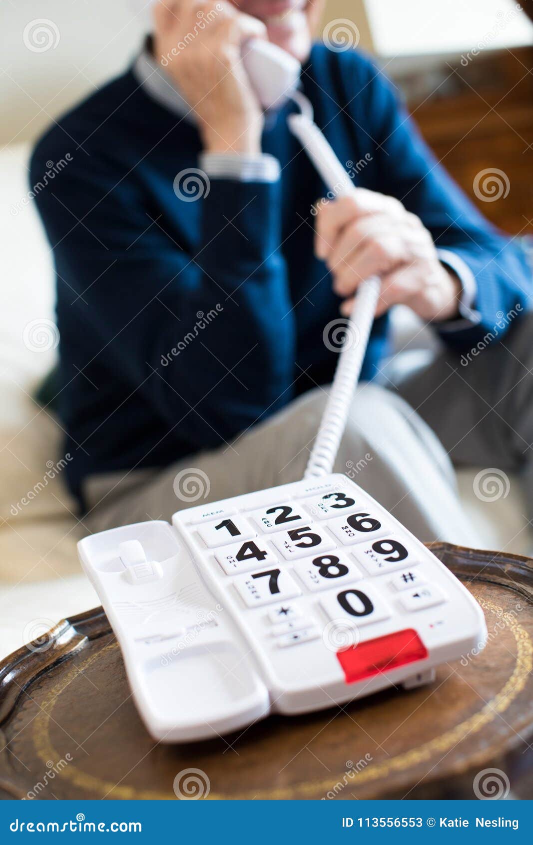 Close Up of Senior Man Using Telephone with Oversized Keypad at Stock ...