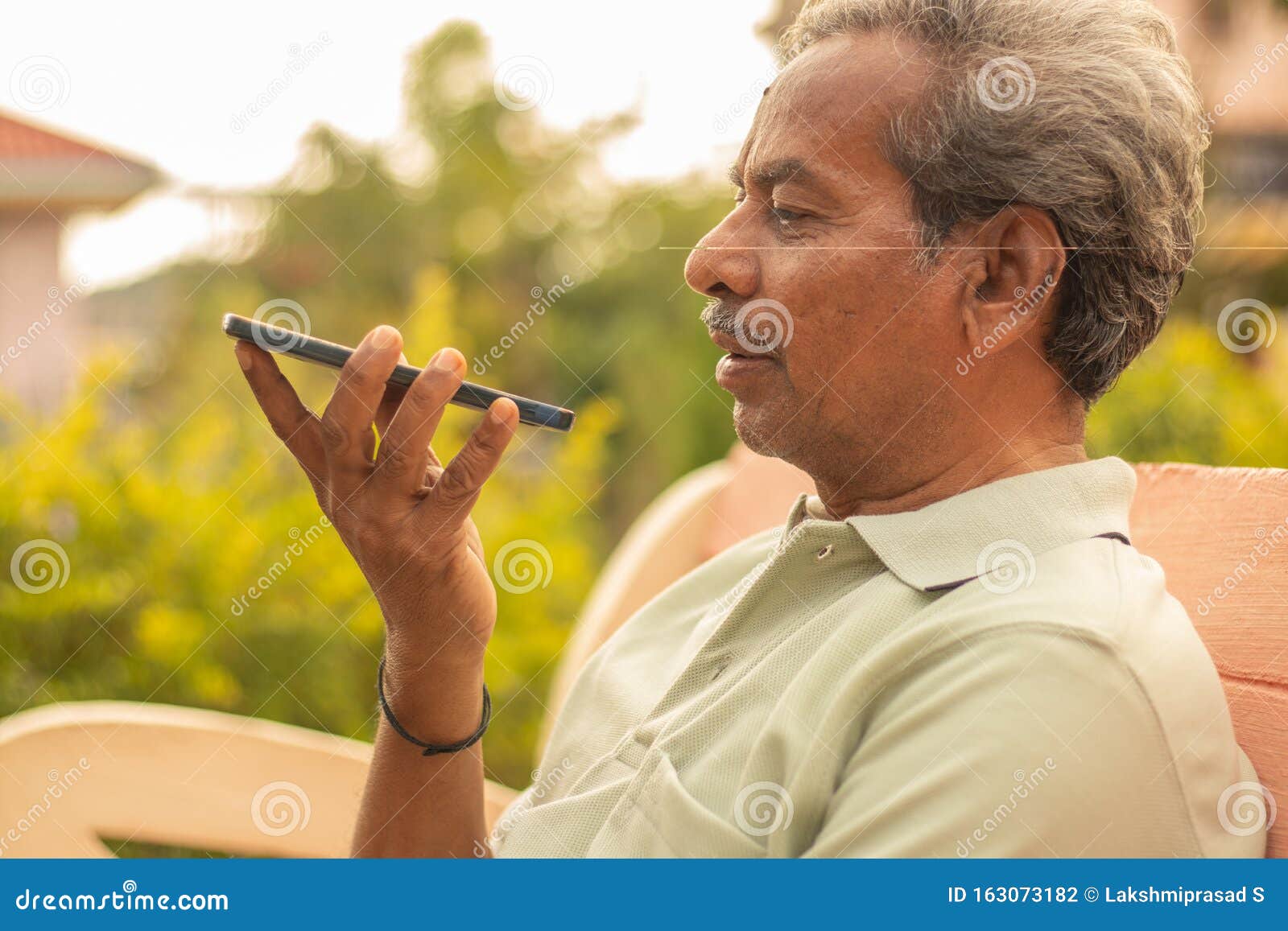 Senior Man Using Virtual Assistant in Phone - Indian Elder Man Using ...