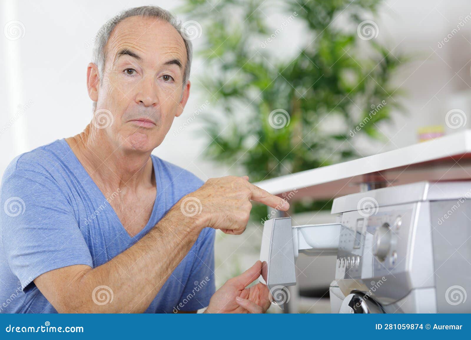 Senior Man Using Washing Machine Stock Photo - Image of person, laundry ...