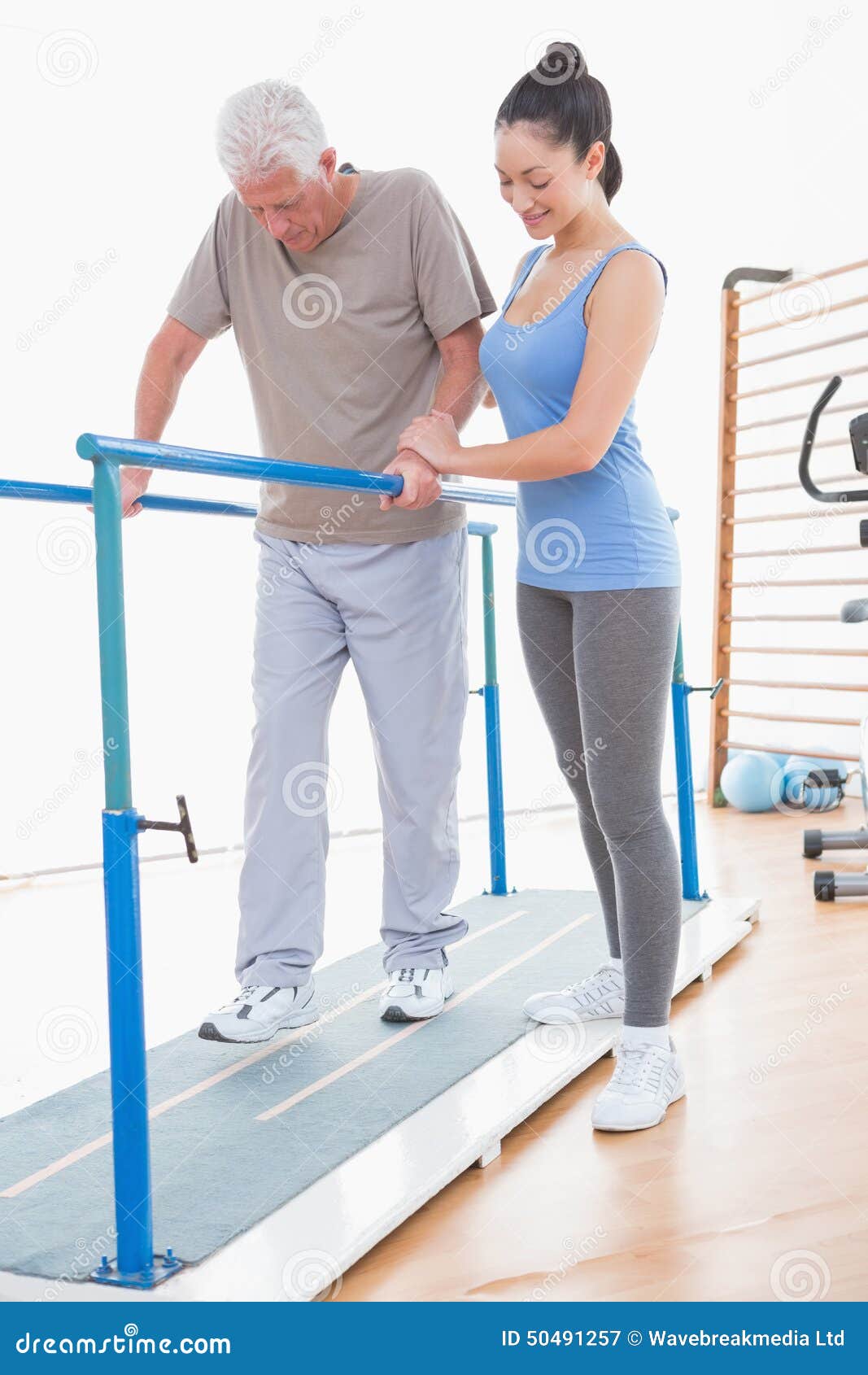 Senior Man Walking with Parallel Bars and Coach Help Stock Image ...