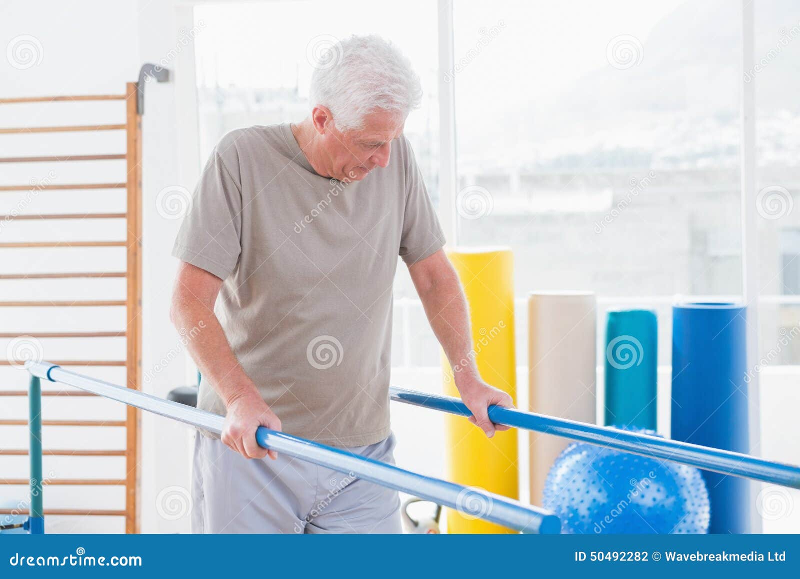 Senior Man Walking with Parallel Bars Stock Photo - Image of retirement ...