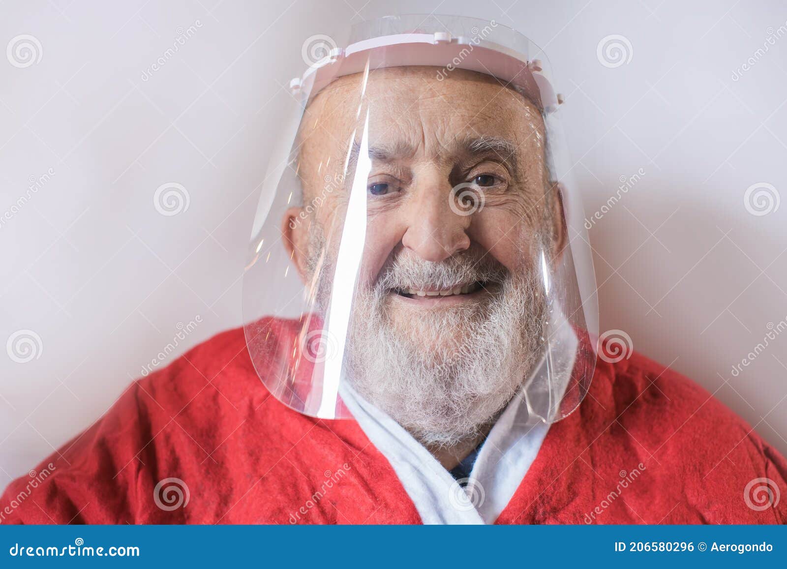 Senior Man Wearing a Protective Visor and Santa Claus Suit Stock Photo ...