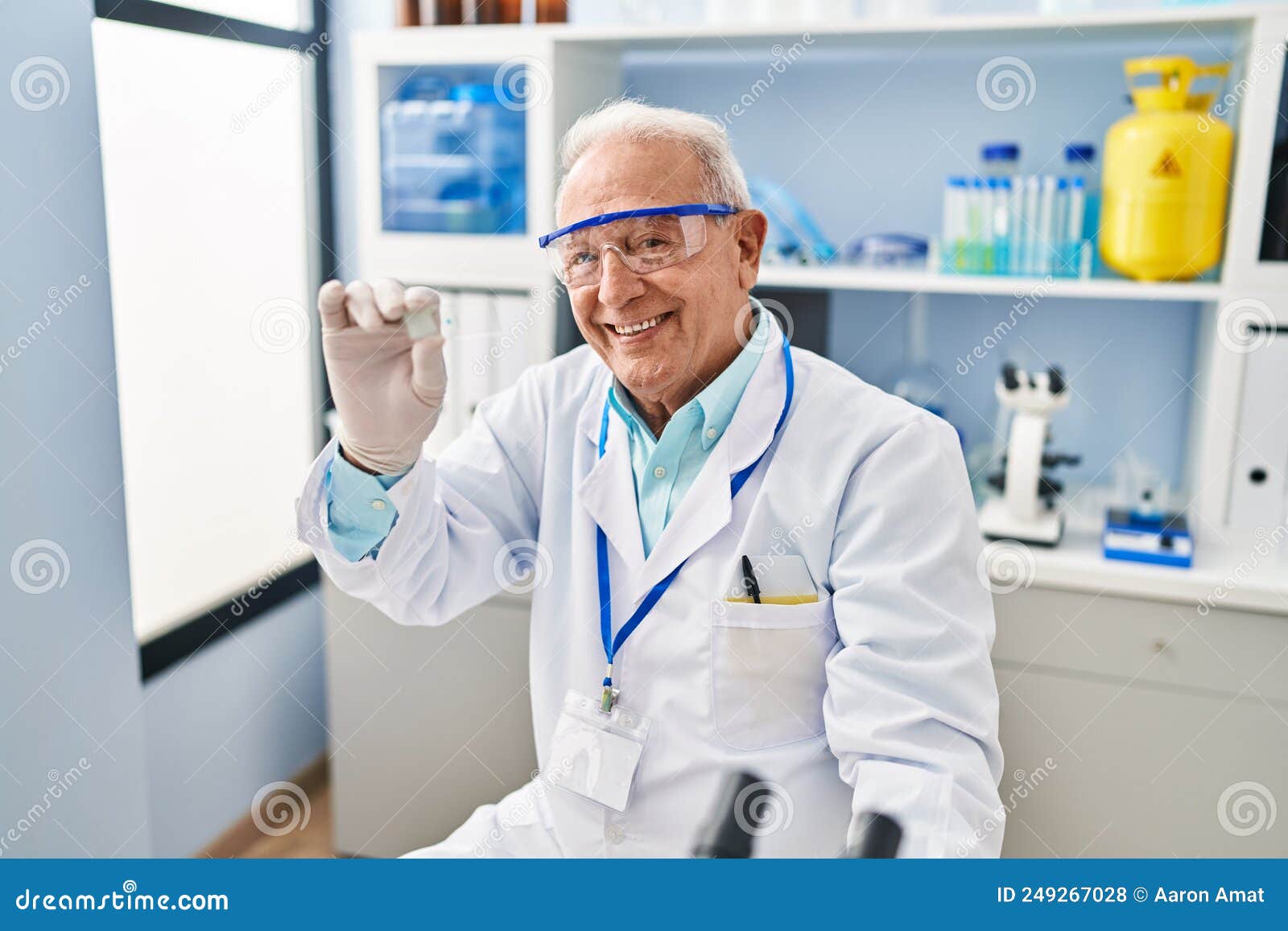 Senior Man Wearing Scientist Uniform Holding Sample at Laboratory Stock ...