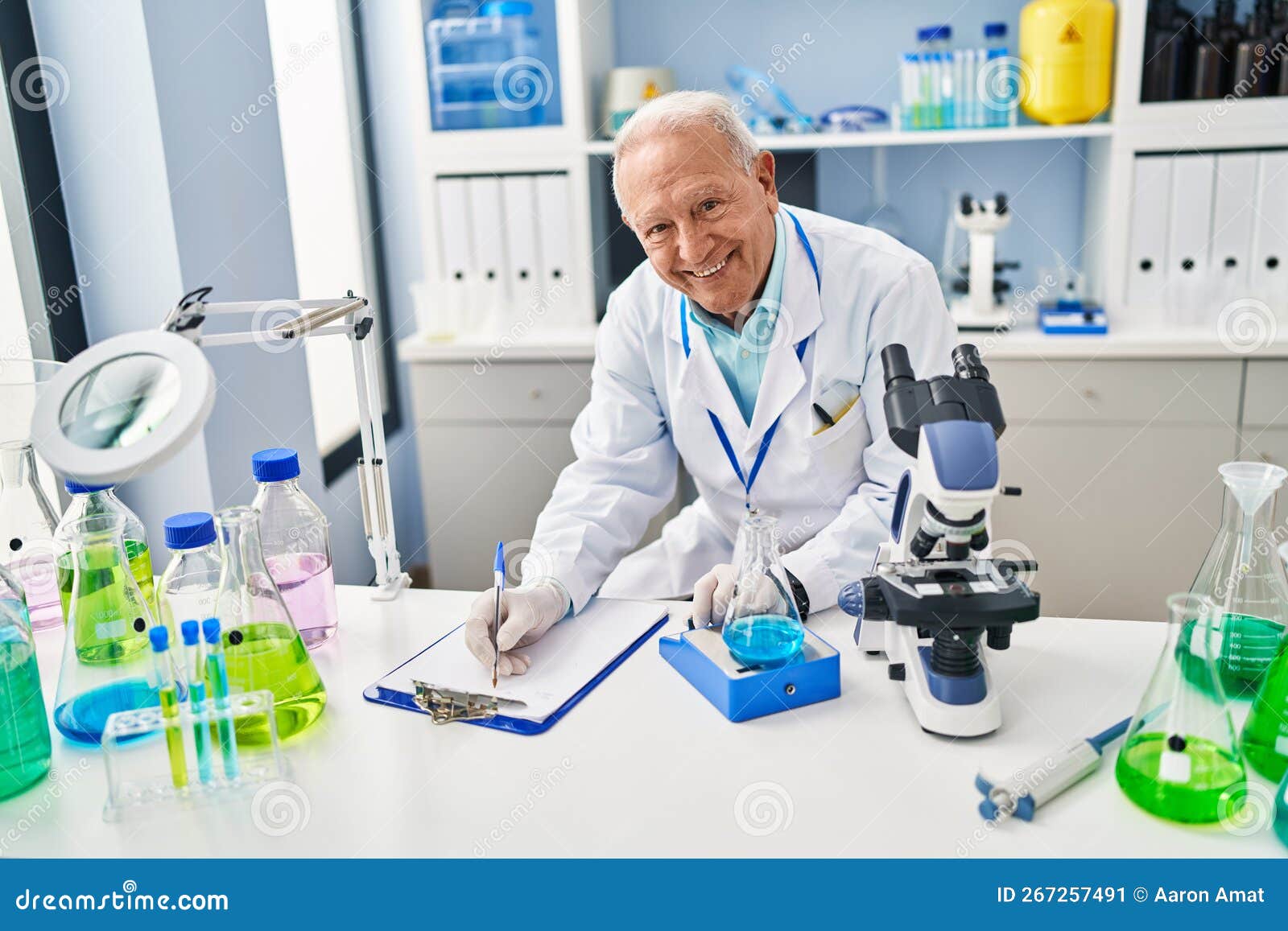 Senior Man Wearing Scientist Uniform Measuring Liquid at Laboratory ...