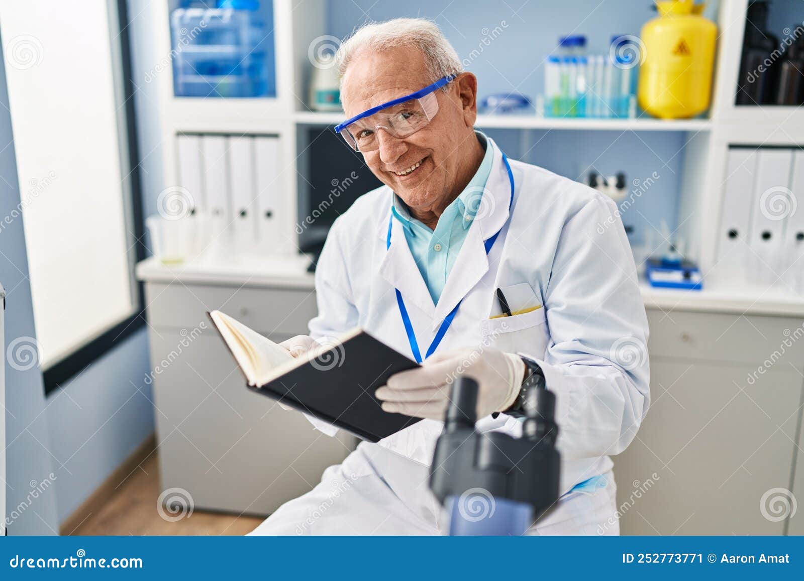 Senior Man Wearing Scientist Uniform Reading Book at Laboratory Stock ...
