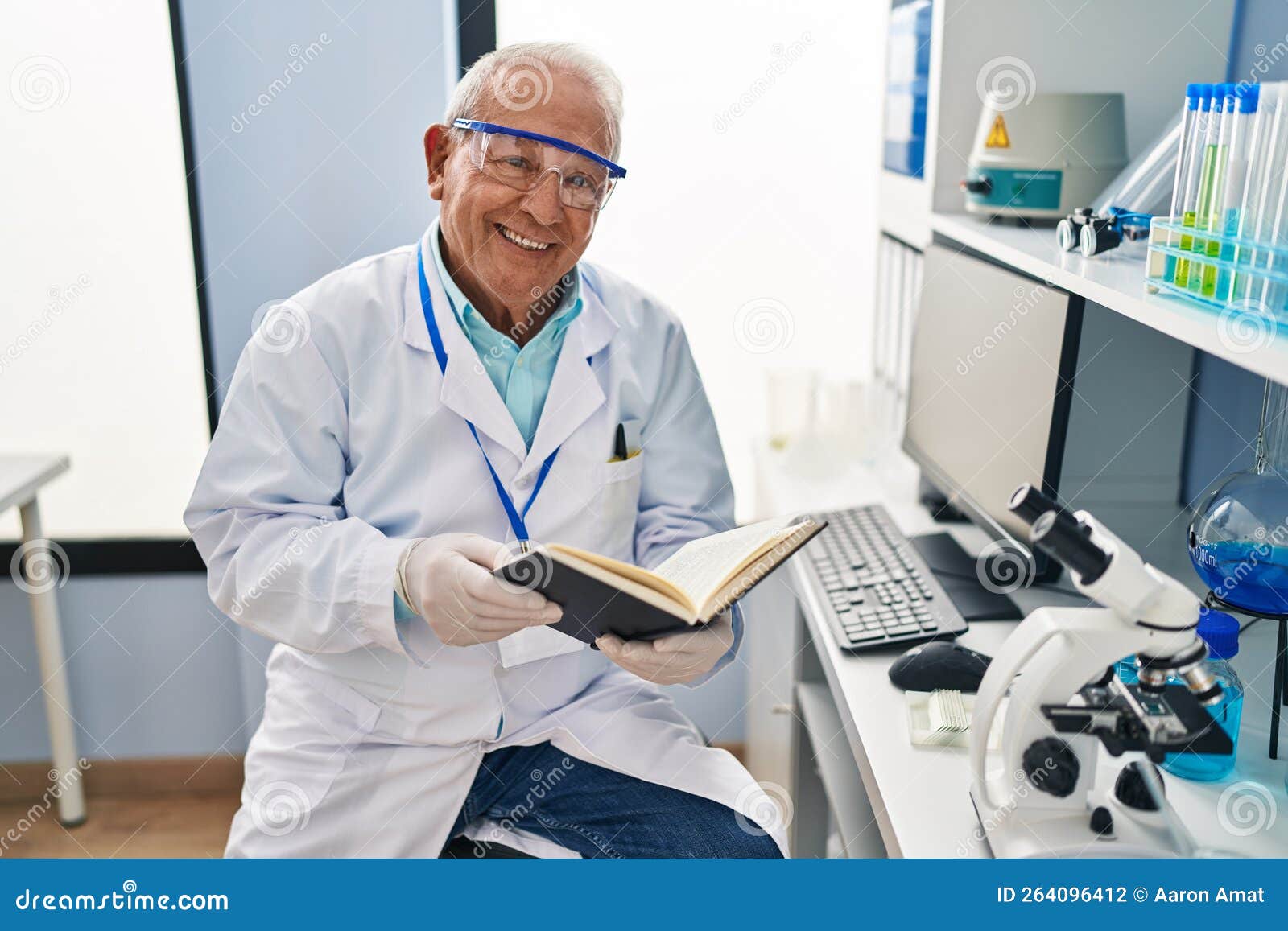 Senior Man Wearing Scientist Uniform Reading Book at Laboratory Stock ...