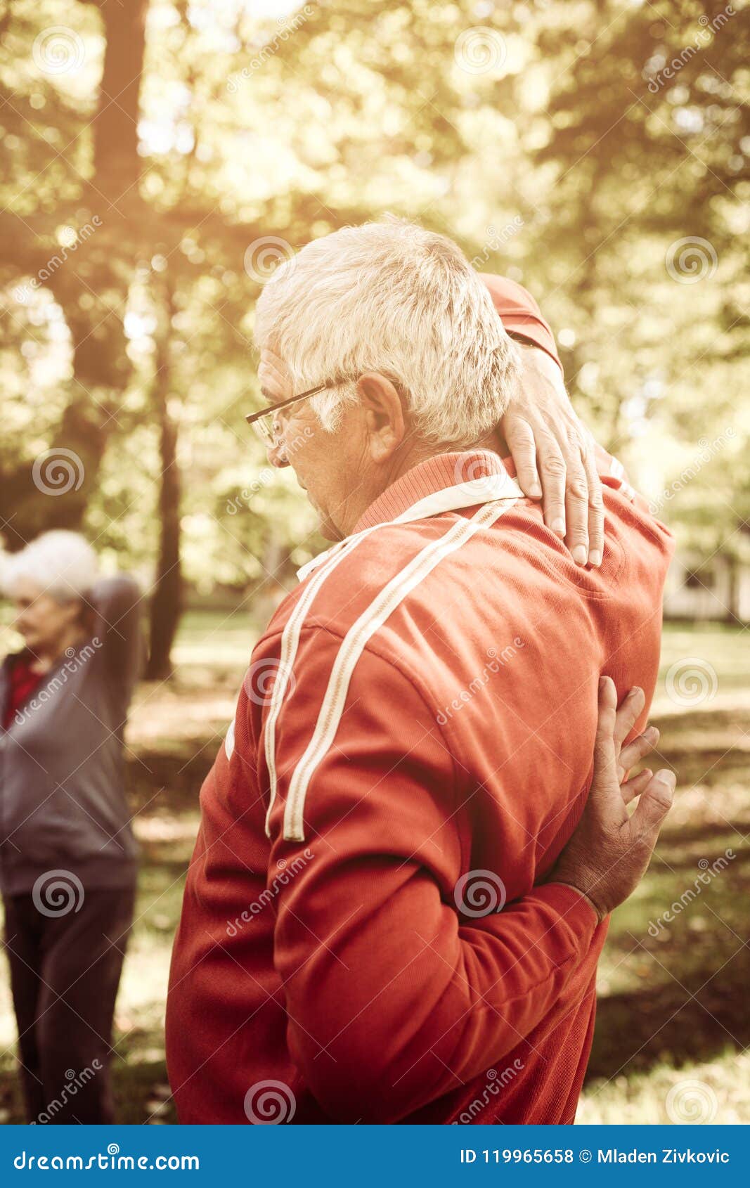 Man Working Exercising for Hands and Back in Park. Stock Photo - Image ...