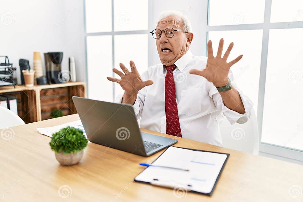 Senior Man Working at the Office Using Computer Laptop Afraid and ...