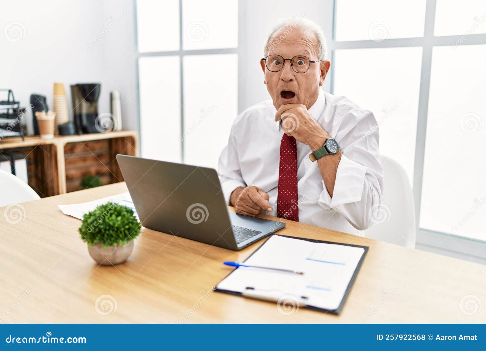 Senior Man Working at the Office Using Computer Laptop Looking ...