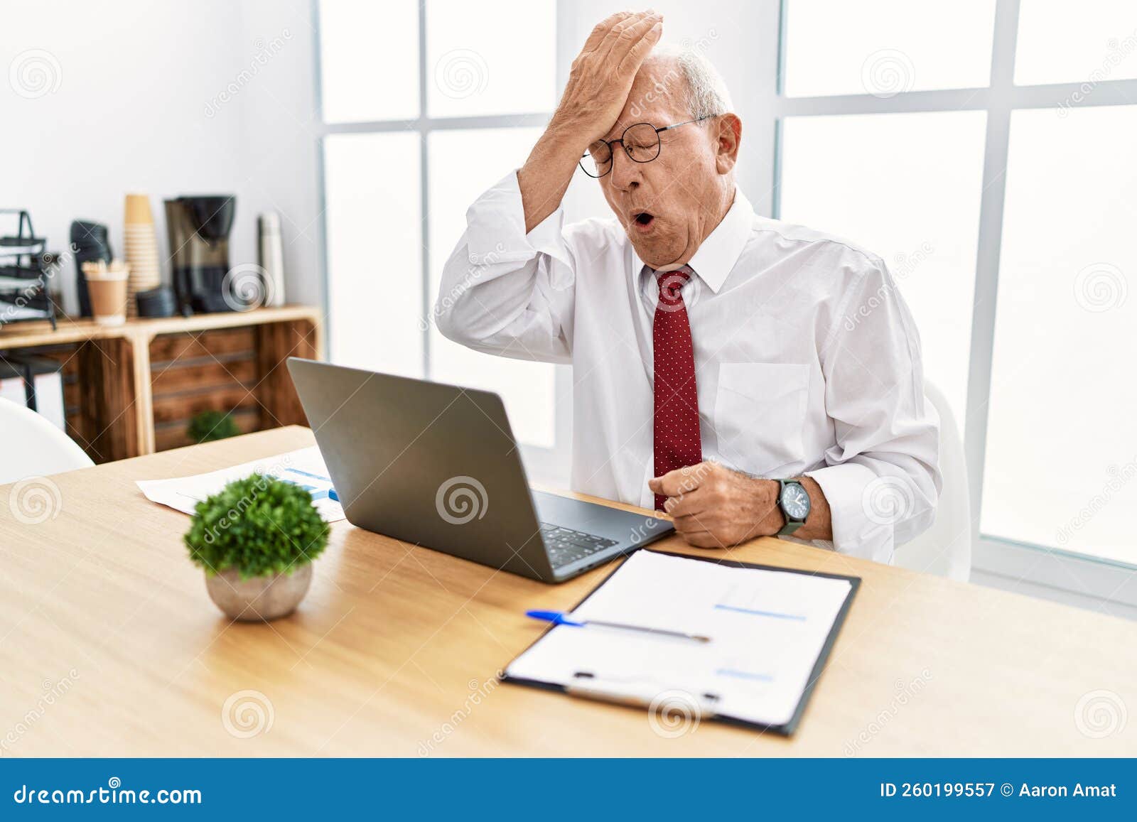 Senior Man Working at the Office Using Computer Laptop Surprised with ...
