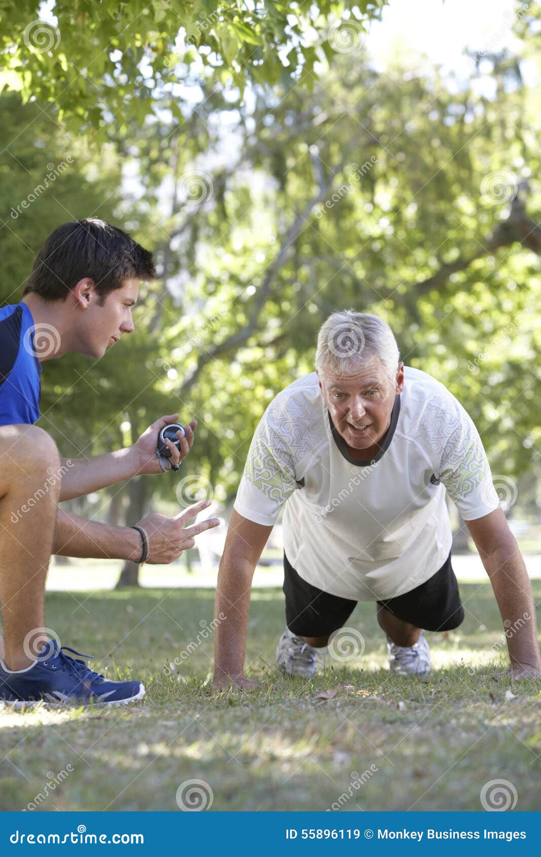 Senior Man Working with Personal Trainer in Park Stock Image - Image of ...