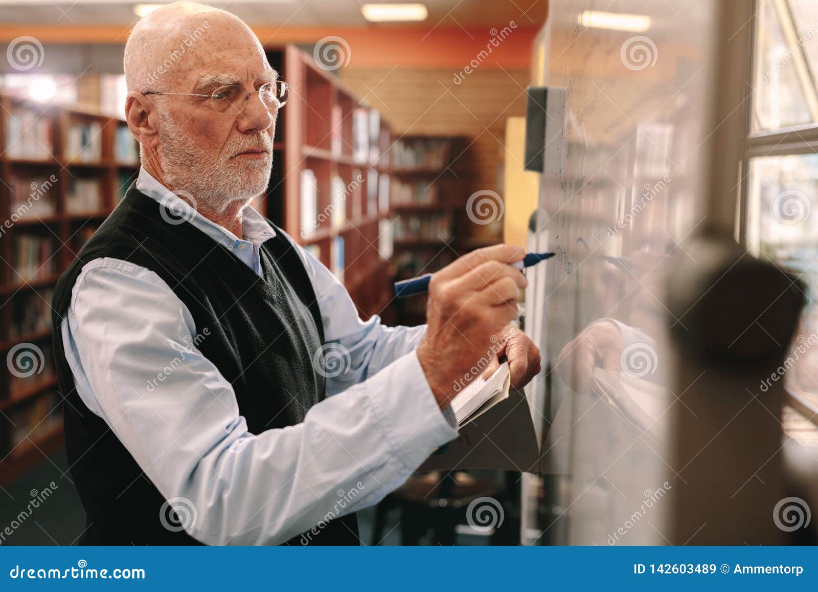 Senior Man Writing on the Classroom Board Stock Image - Image of ...