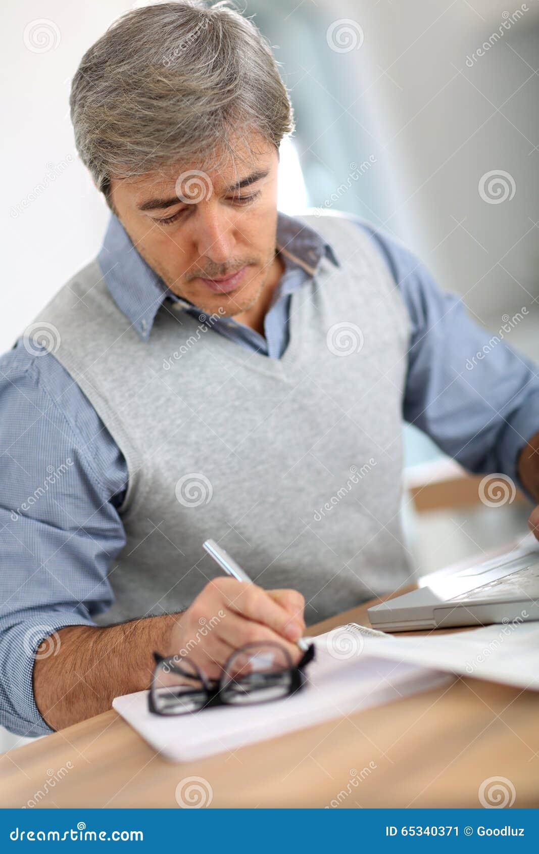Senior Man Writing Notes Working on Laptop Stock Image - Image of ...