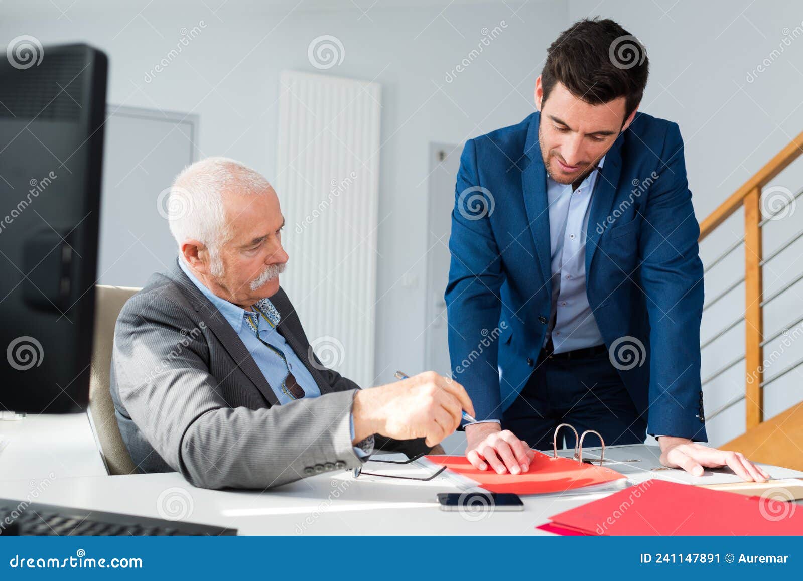 Senior Manager in Discussion with Younger Colleague Stock Image - Image ...