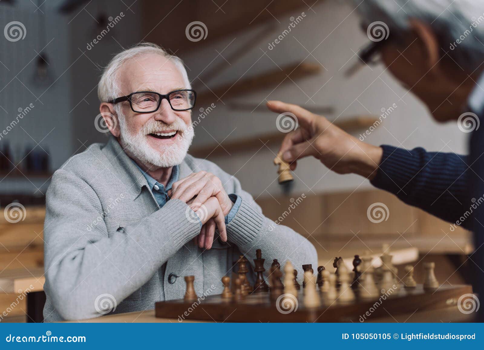 Senior men playing chess stock image. Image of european - 105050105