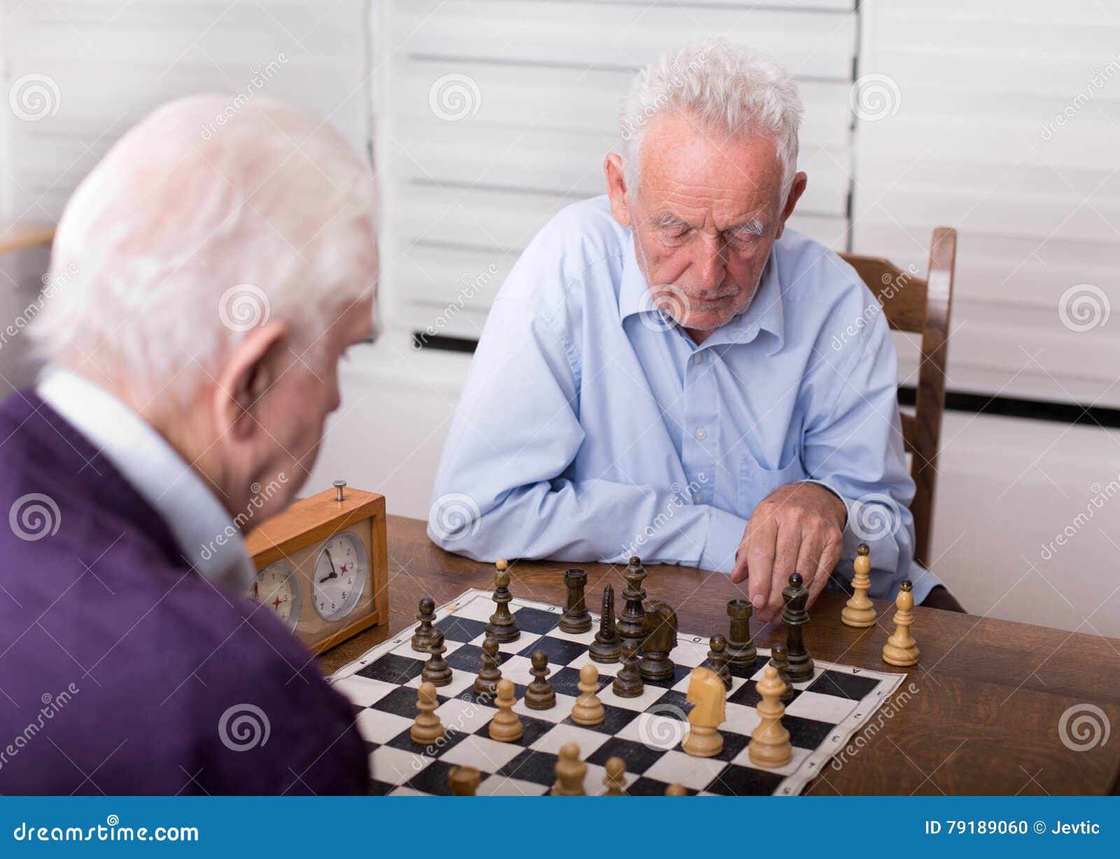 Senior men playing chess stock photo. Image of competition - 79189060