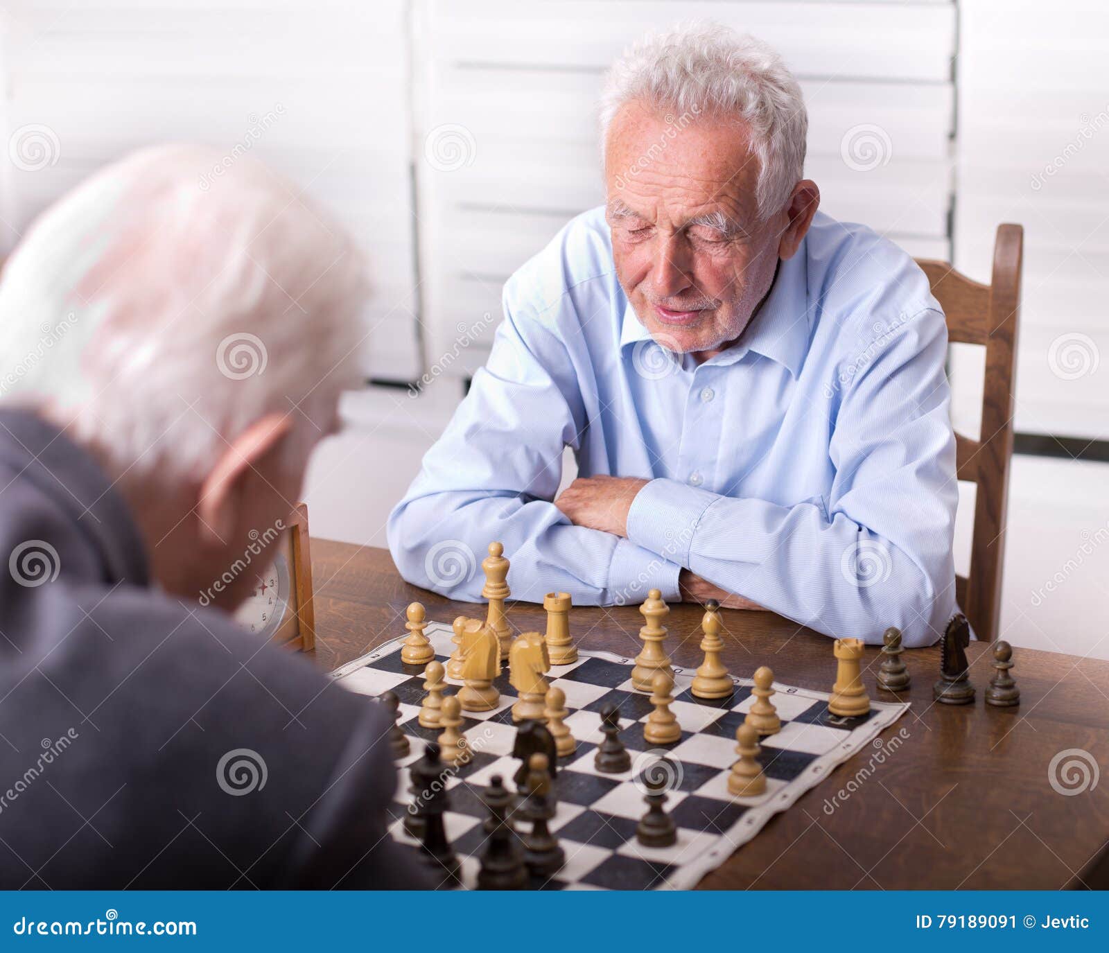 Senior men playing chess stock image. Image of people - 79189091
