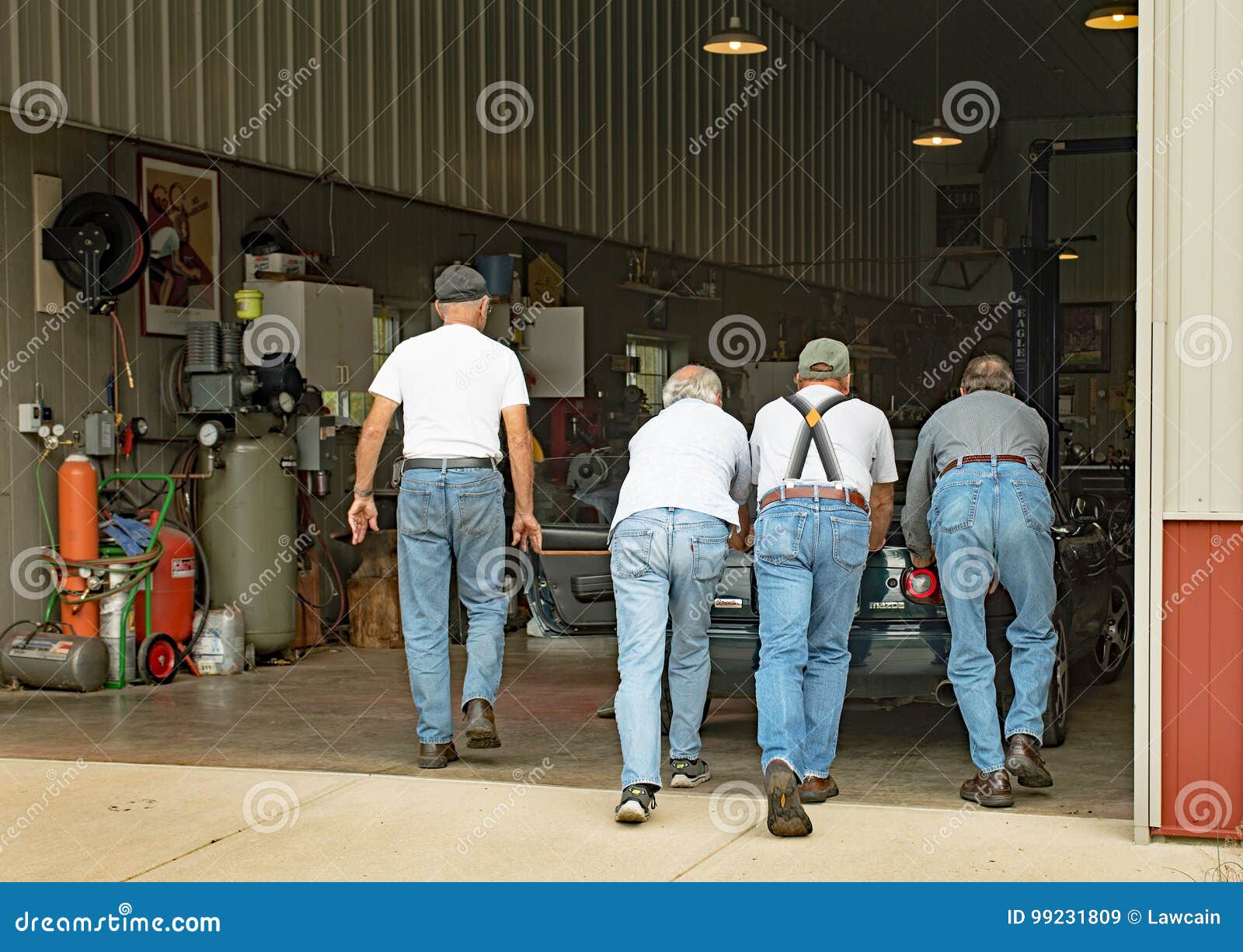 Senior Men Pushing Stalled Car into Garage Editorial Stock Image ...