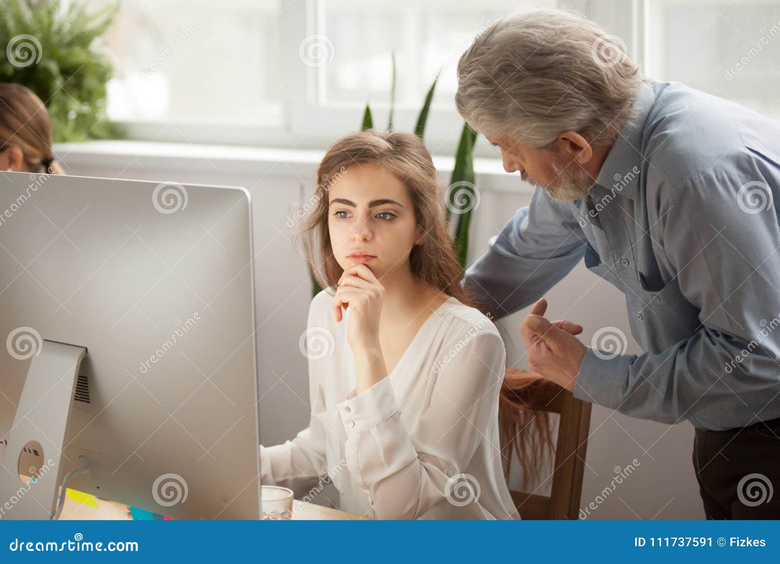 Senior Mentor Teaching Young Female Intern Using Computer in Off Stock ...