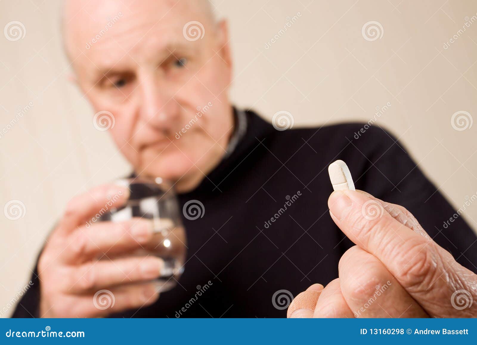 Senior Older Man Holding Tablet or Pill with Water Stock Photo - Image ...