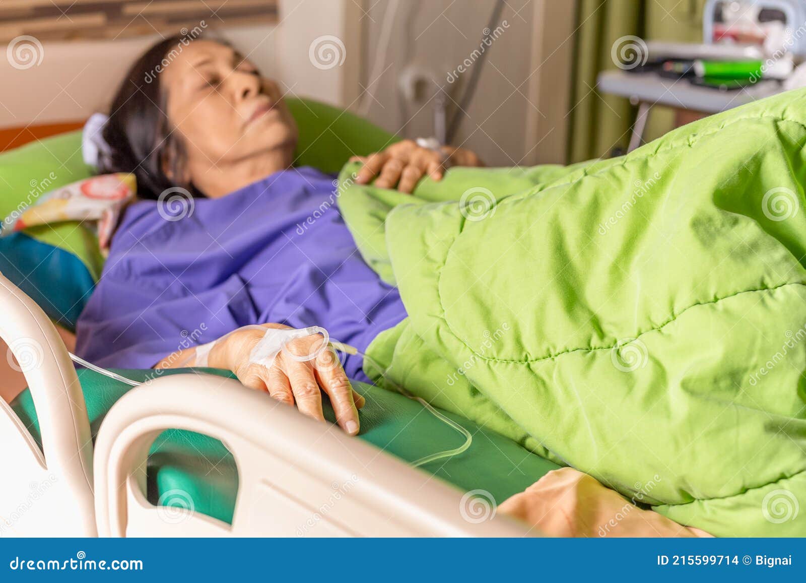 Senior Patient Hand with Injection Saline Lying in the Hospital Bed ...