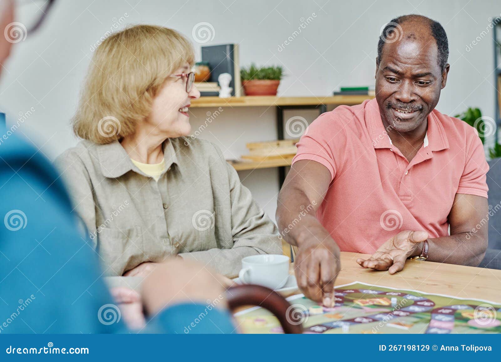 Senior People Playing Game at Table Stock Image - Image of ...