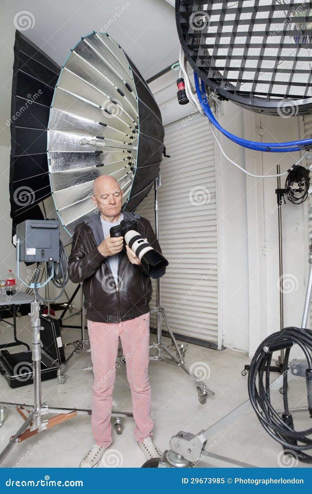 Senior Photographer with Camera in Studio Stock Image - Image of ...