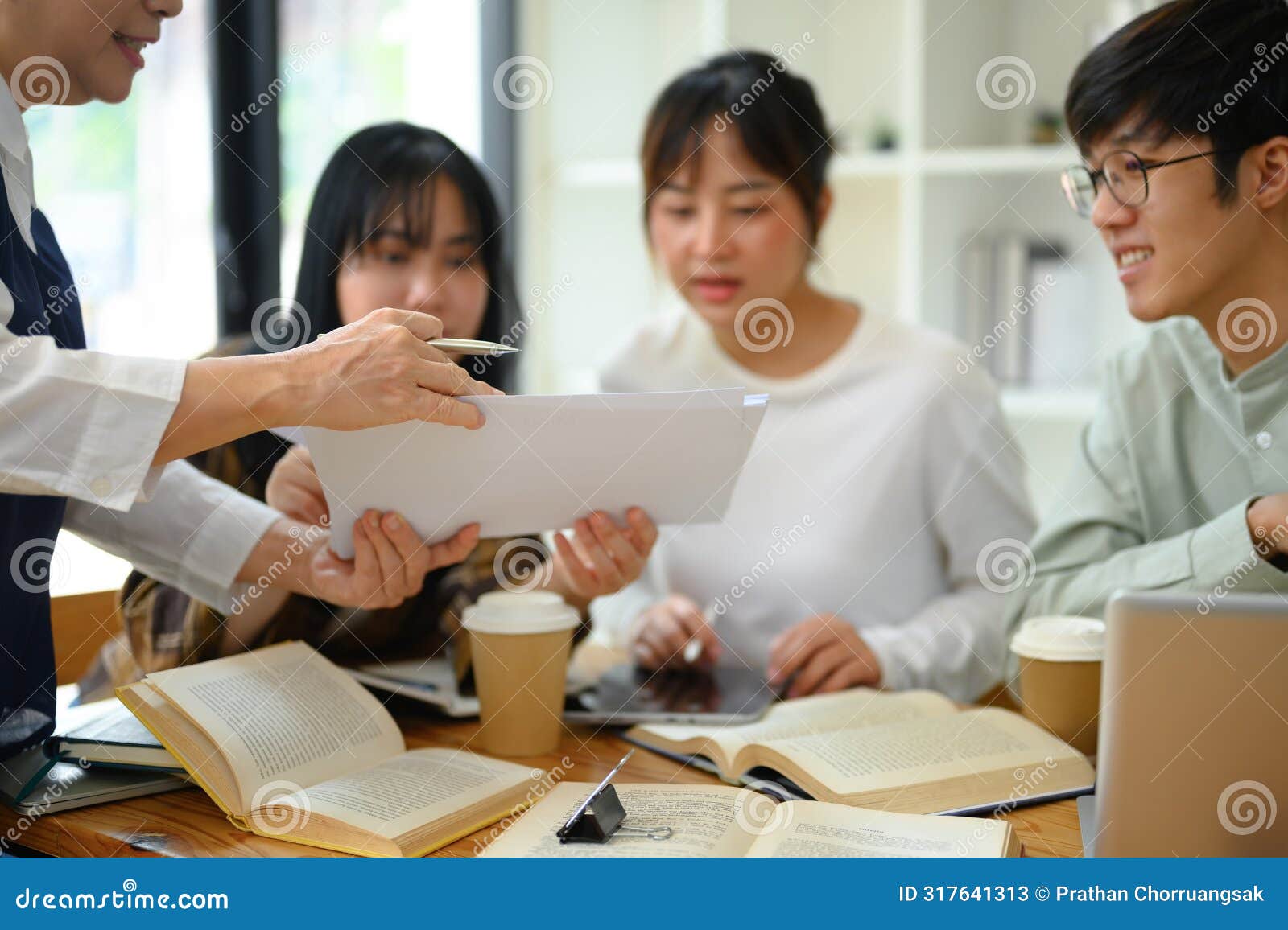 Senior Professor Explaining Something To Students during Class at ...