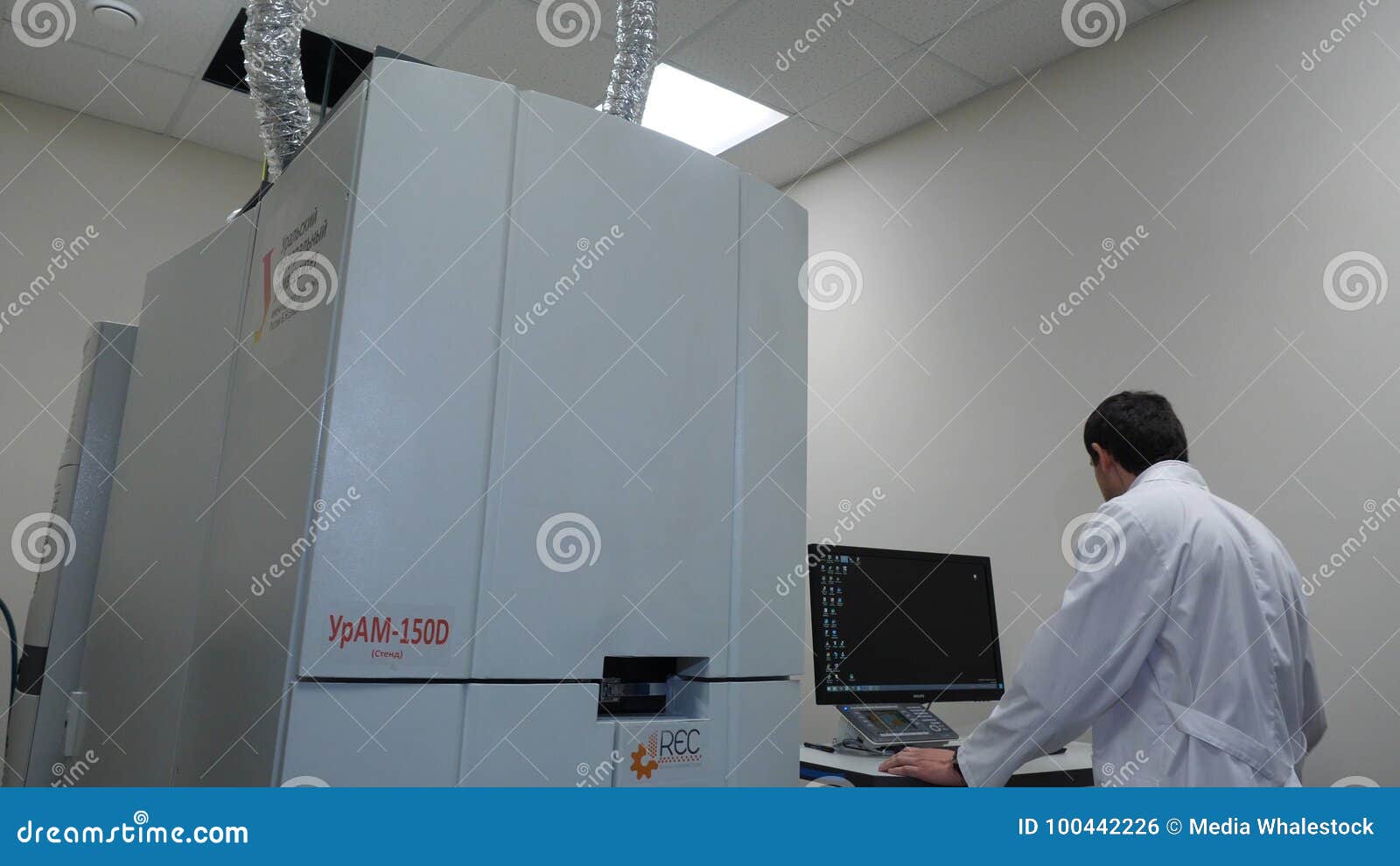 Senior Researche Rusing a Computer in the Lab while Working on an ...