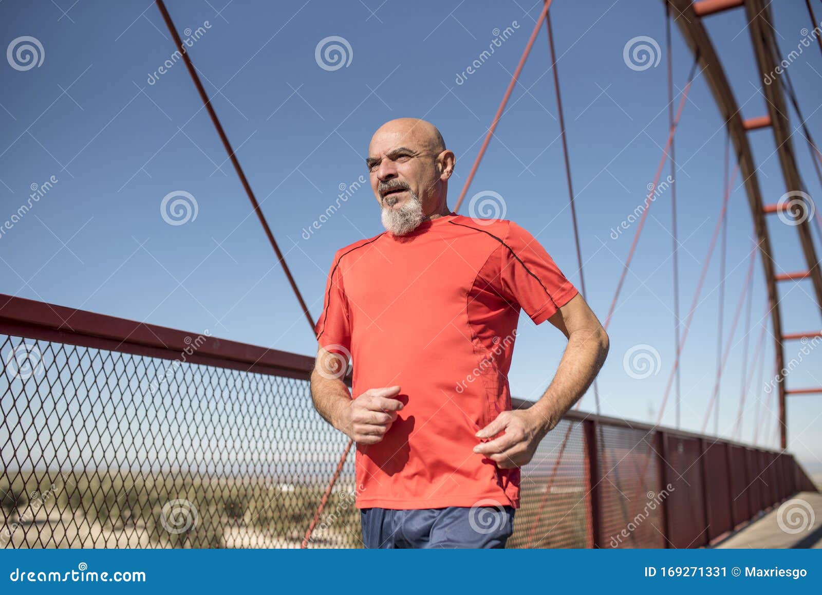 Senior Runner Training on a Bridge Stock Image - Image of active ...