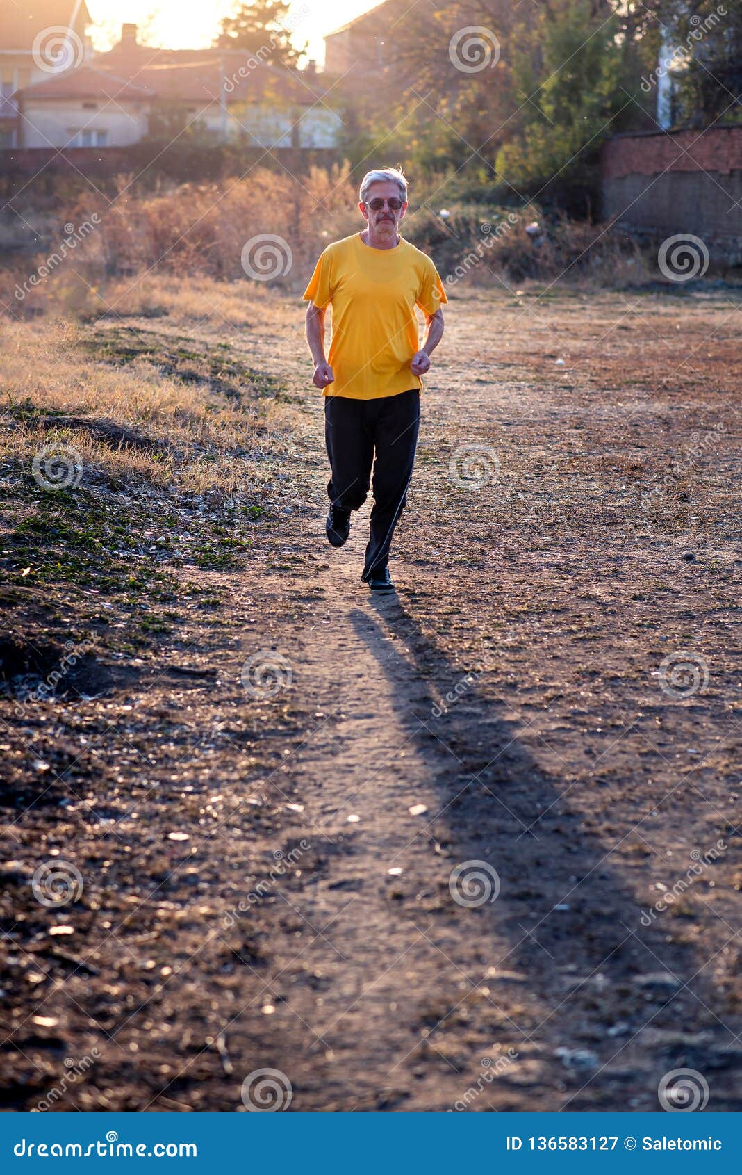 Senior running in the park stock image. Image of outdoors - 136583127