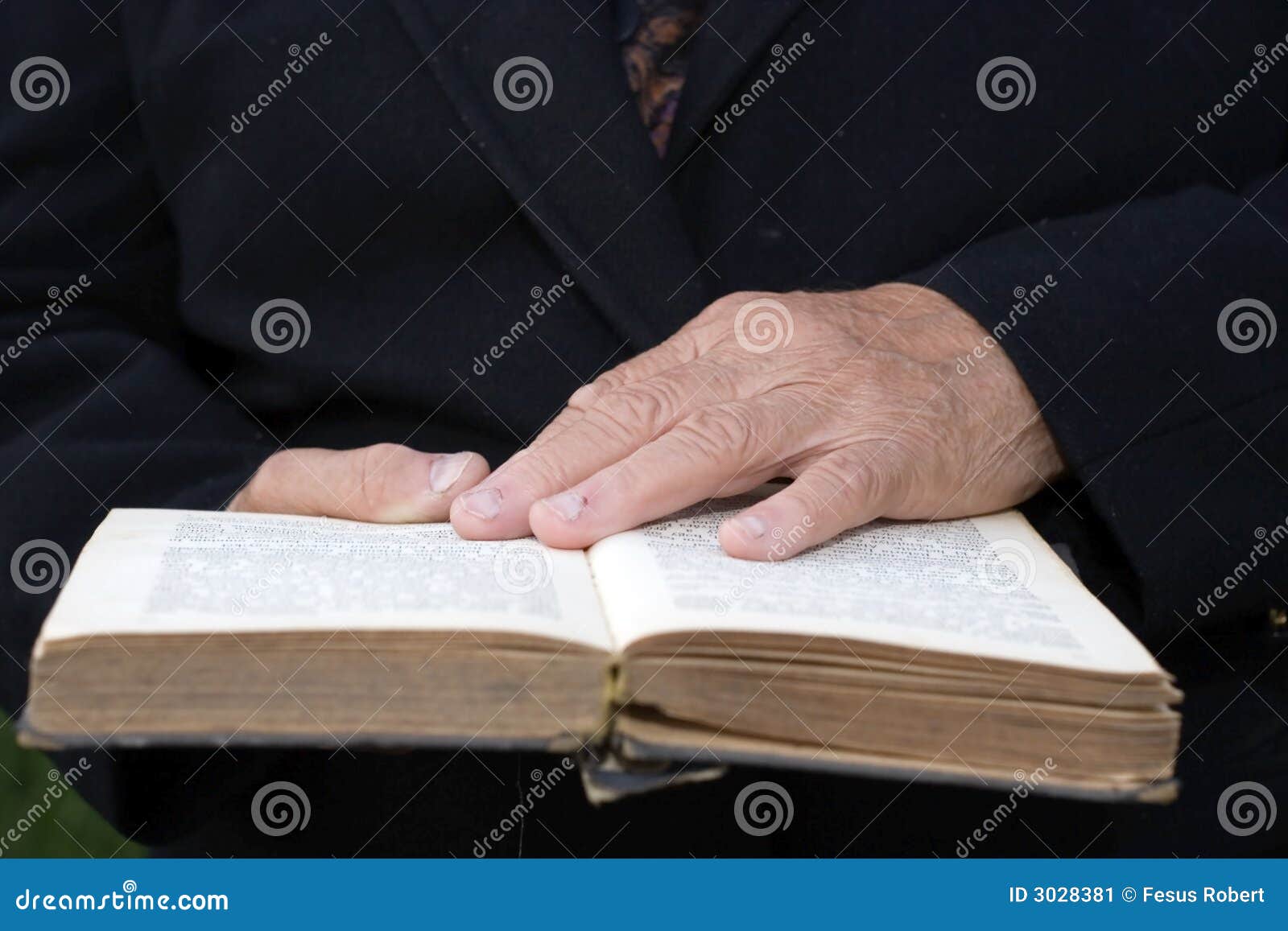 Senior s hands on old book stock image. Image of believer - 3028381