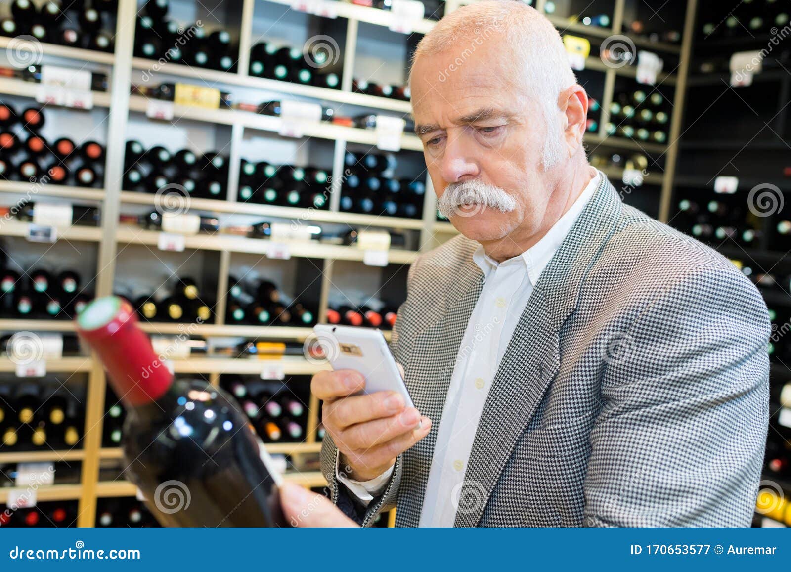 Senior Scanning Barcode on Wine Bottle through Smartphone Stock Image ...