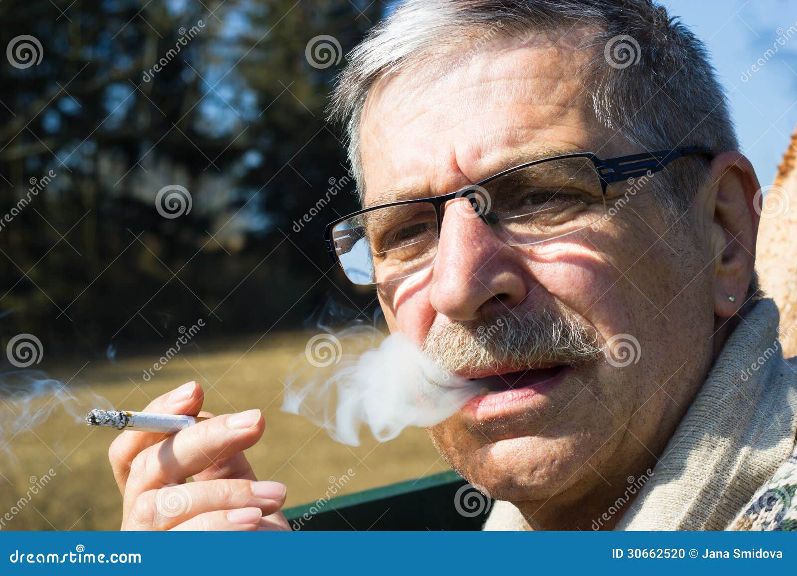 Senior smokes cigarette stock photo. Image of hazardous - 30662520