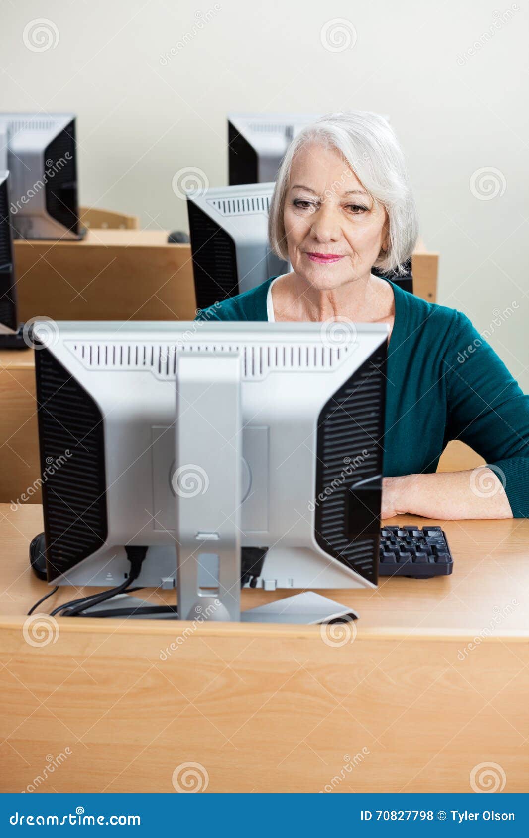 Senior Student Using Computer in Classroom Stock Photo - Image of ...