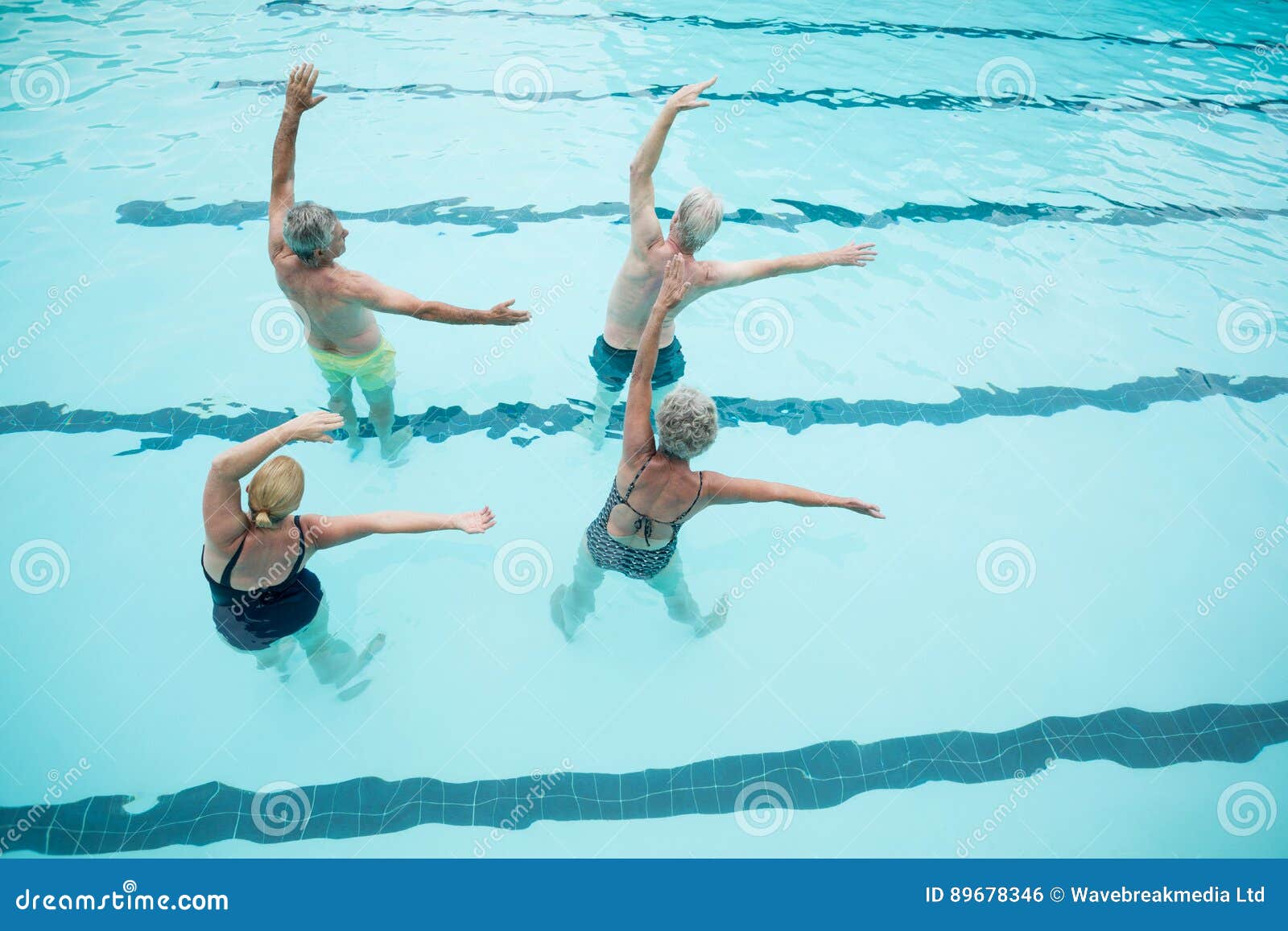 Senior Swimmers Exercising in Swimming Pool Stock Photo - Image of ...