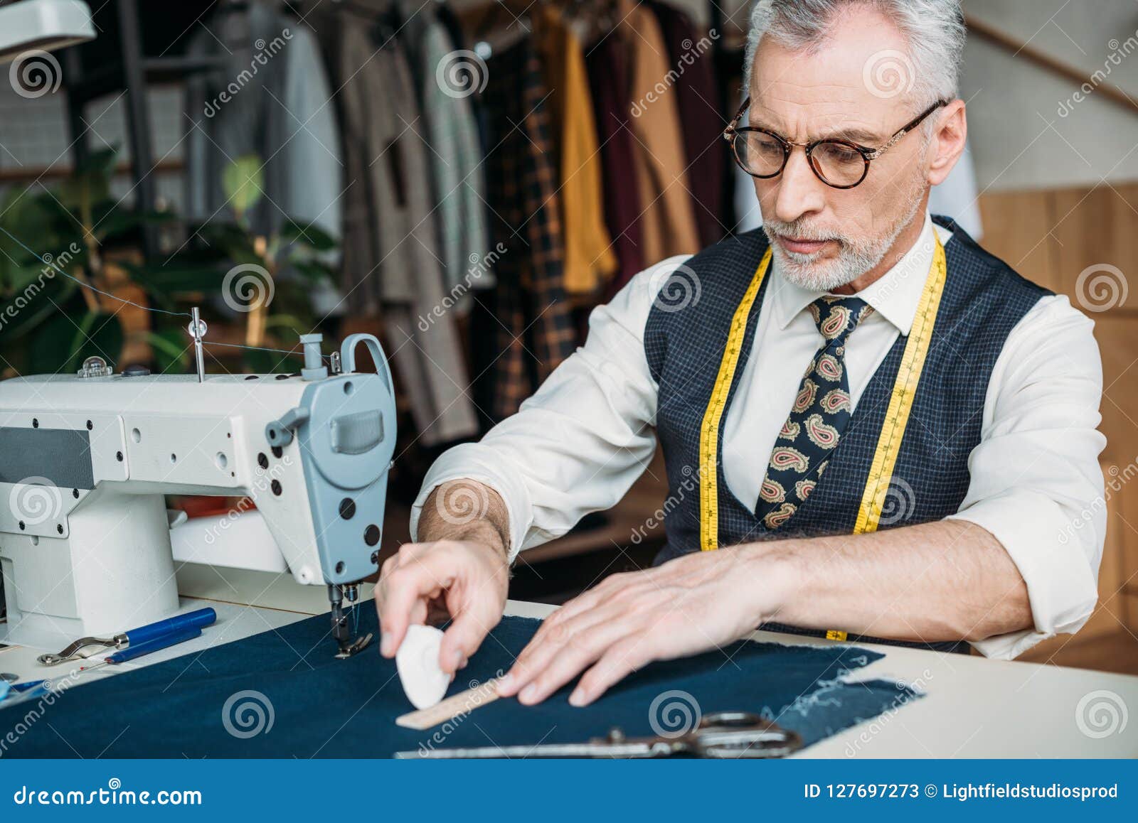 Senior Tailor Making Pattern on Cloth with Piece of Chalk Stock Image ...