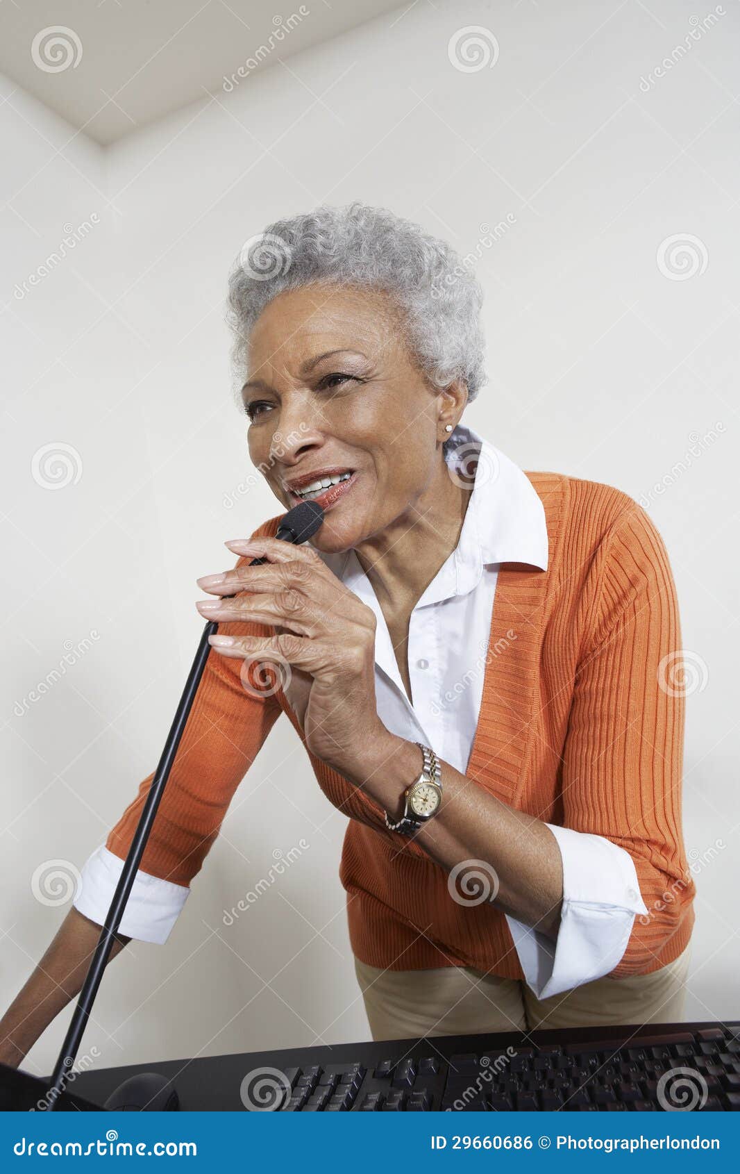 Senior Teacher Holding Microphone Stock Photo - Image of adult, holding ...