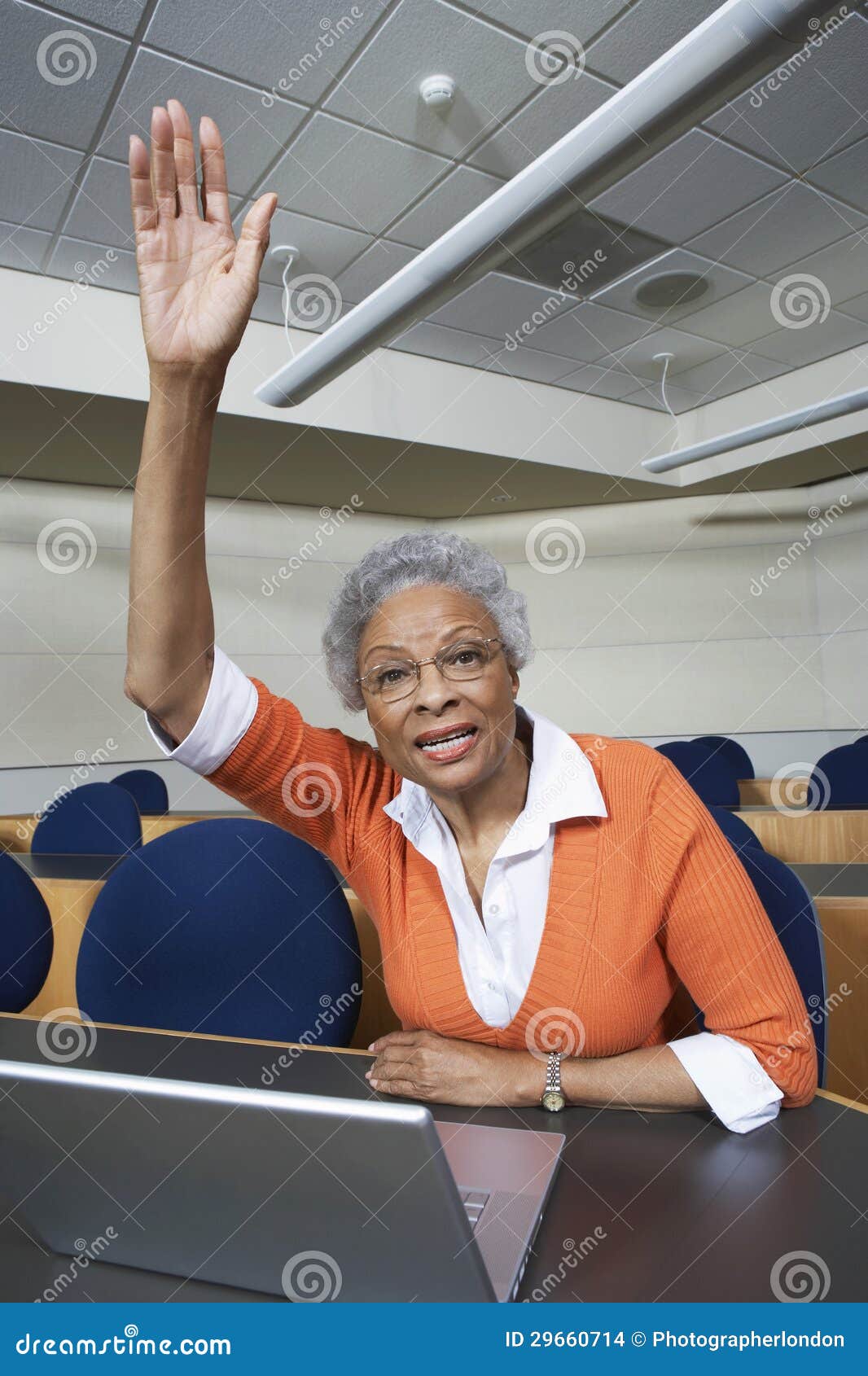 Senior Teacher Raising Hand Stock Photo - Image of classroom, ceiling ...