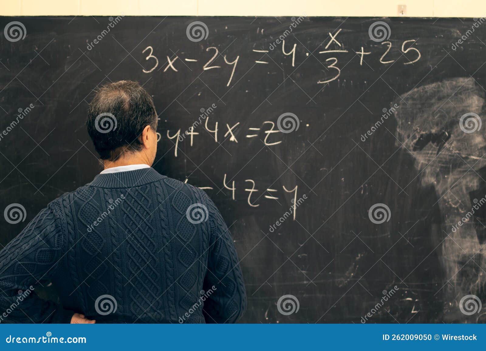 Male Teacher Writing Equations on a Blackboard Stock Photo - Image of ...