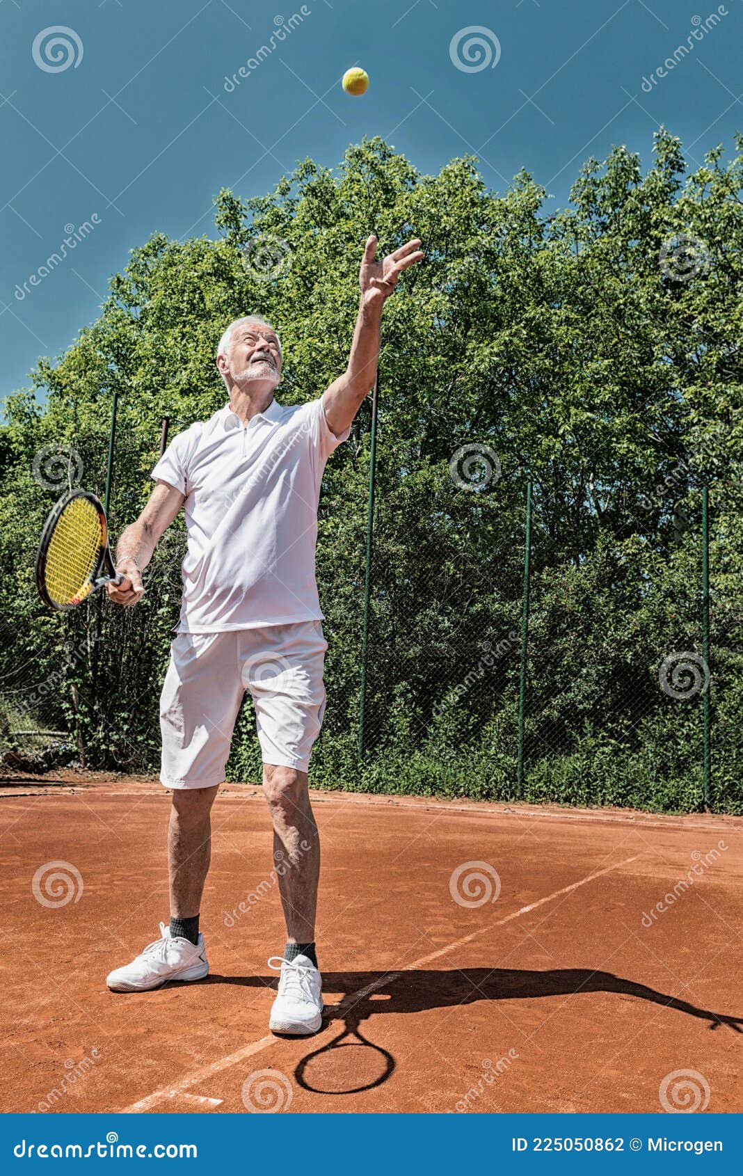 Senior Tennis Player Serving Stock Photo - Image of caucasian, racket ...