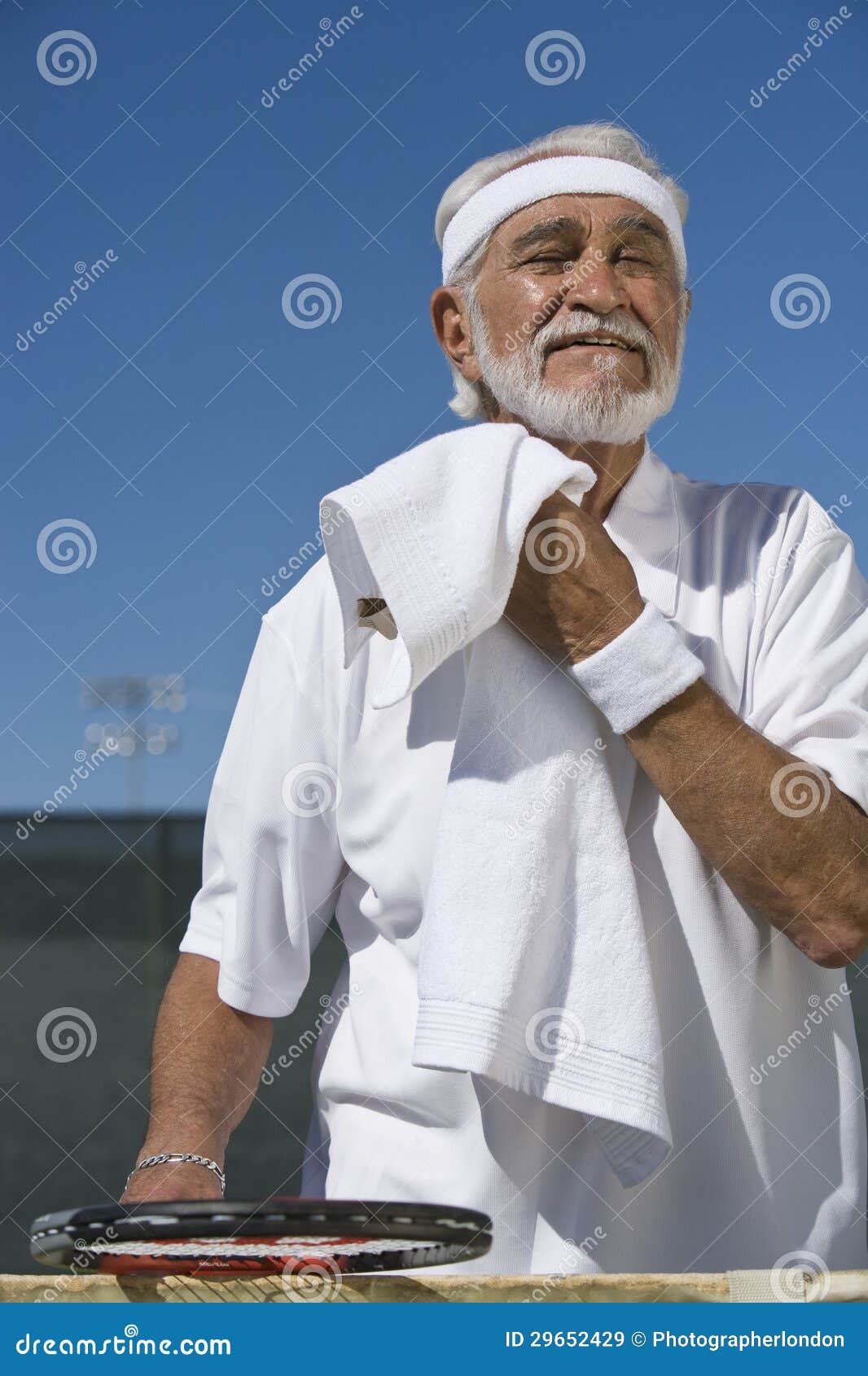 Senior Tennis Player Sweeping Out the Sweat Stock Image - Image of aged ...