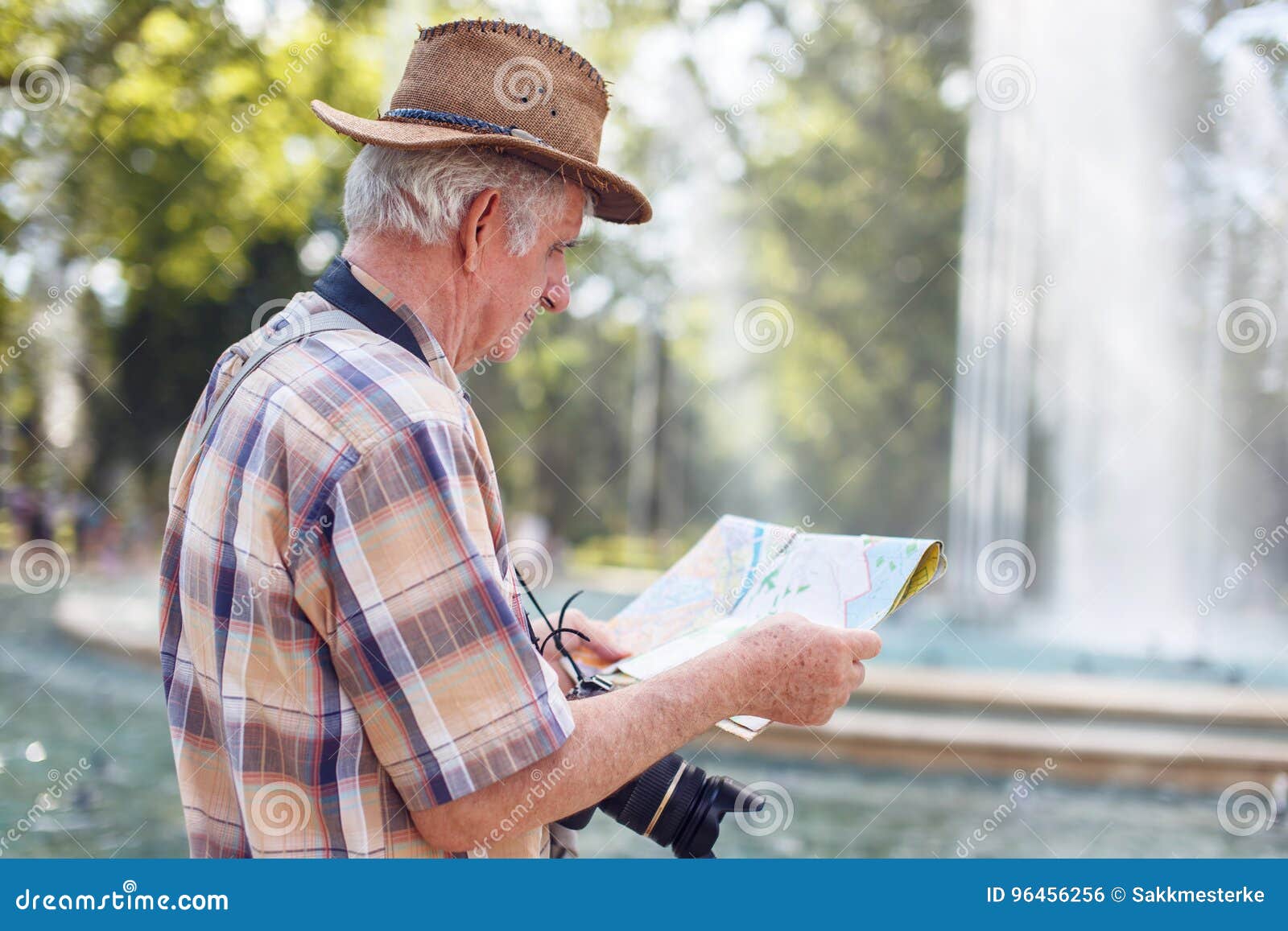 Senior Tourist Man Searching for Destination on Map Stock Photo - Image ...